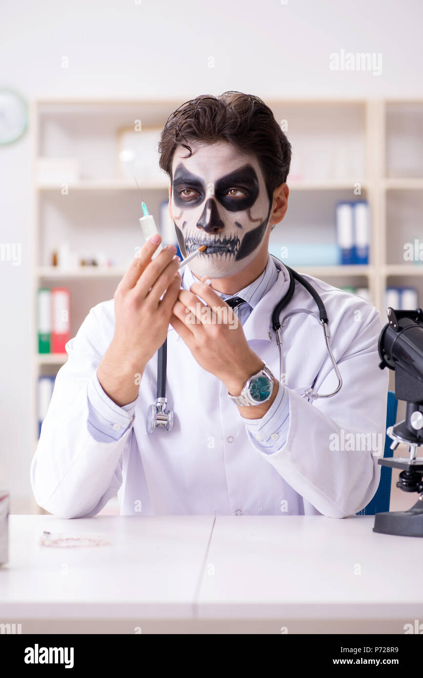 Scary monster doctor working in lab Stock Photo - Alamy