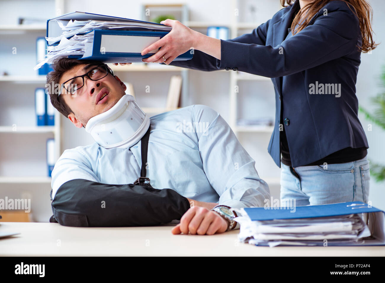 Injured man getting more work from his boss Stock Photo - Alamy
