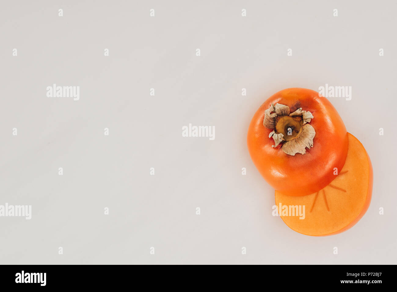 top view of cut persimmon isolated on white Stock Photo - Alamy