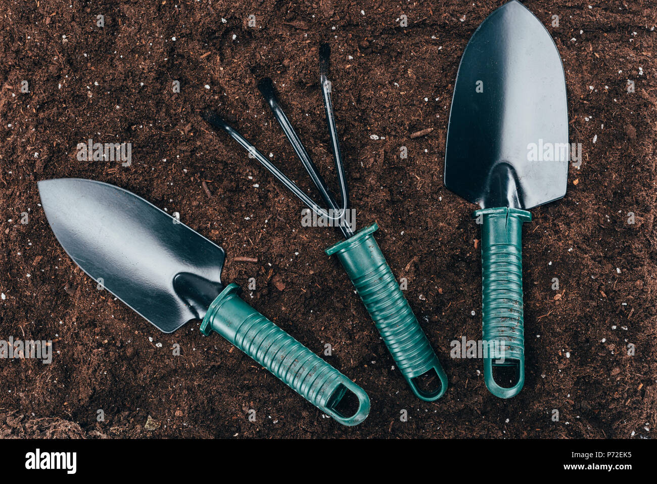 top view of small gardening tools on soil Stock Photo - Alamy