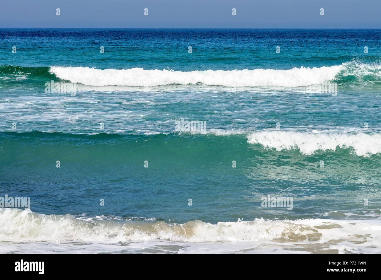 Blue sea with breaking waves forming an abstract pattern Stock Photo ...