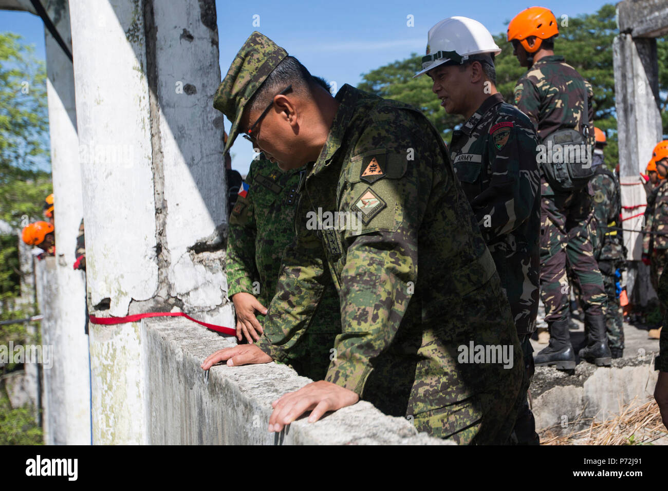 Philippine Army Lt. Gen. Oscar Lactao, center, observes search and ...