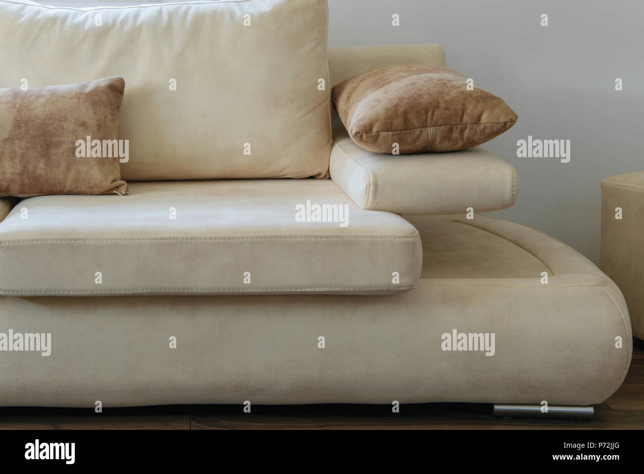 Part of comfortable contemporary sofa in natural colors, home interior ...