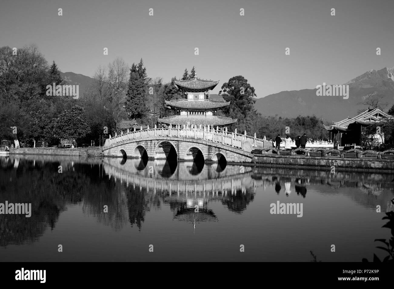 The bridge reflection of Black Dragon Pool (Lijiang, Yunnan, China ...