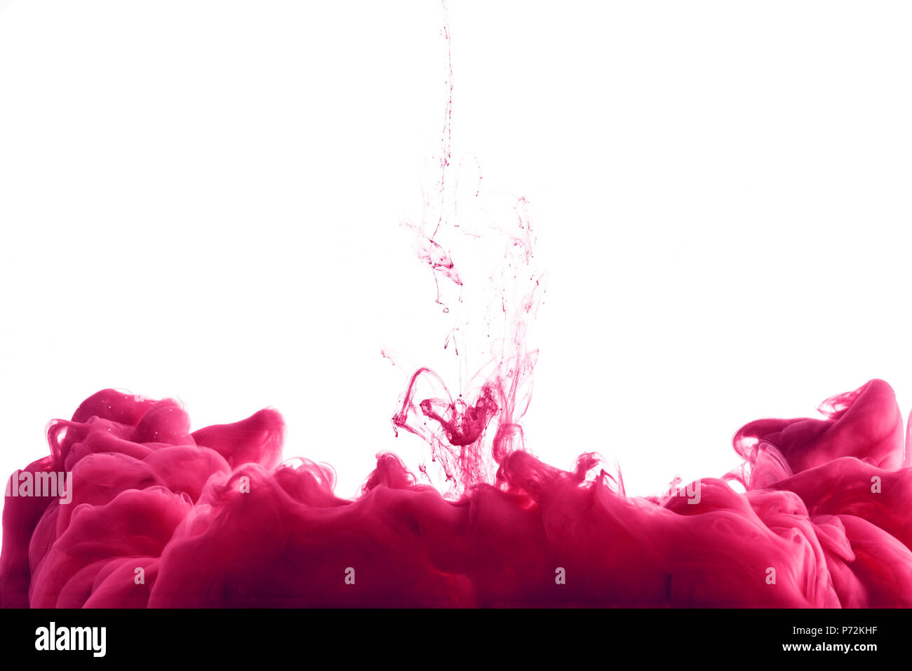 pink smoky paint splash in water, isolated on white with copy space ...