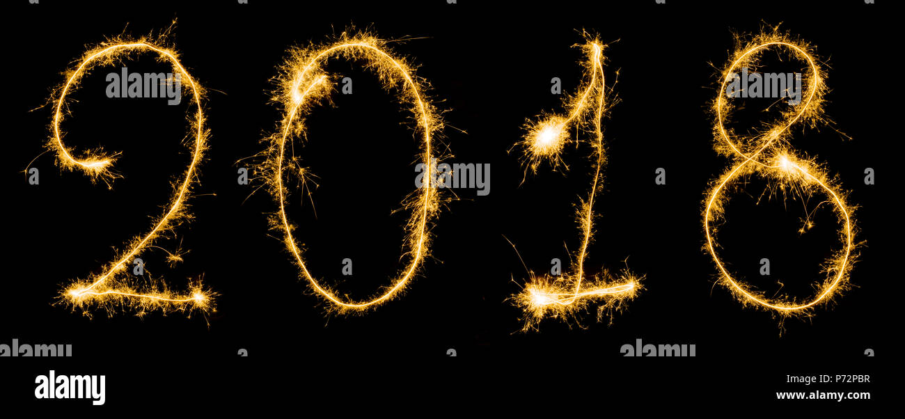 close up view of sparkling 2018 year sign isolated on black Stock Photo ...