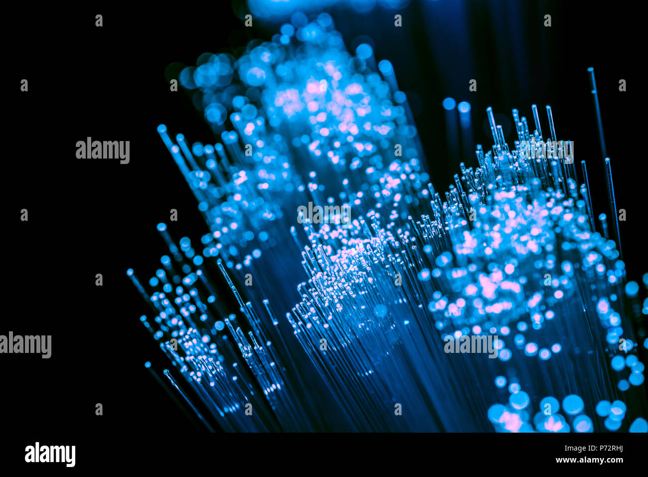 Close up of blurred blue fiber optics background Stock Photo - Alamy