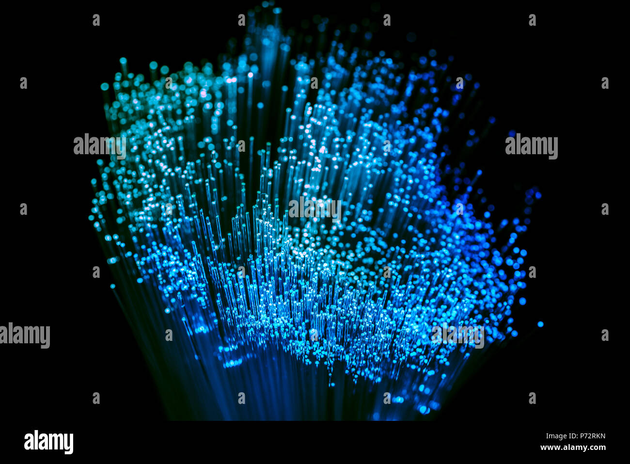 glowing blue fiber optics background Stock Photo - Alamy