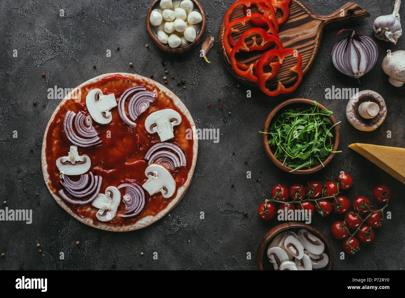 top view of unprepared pizza with ingredients on concrete surface Stock ...