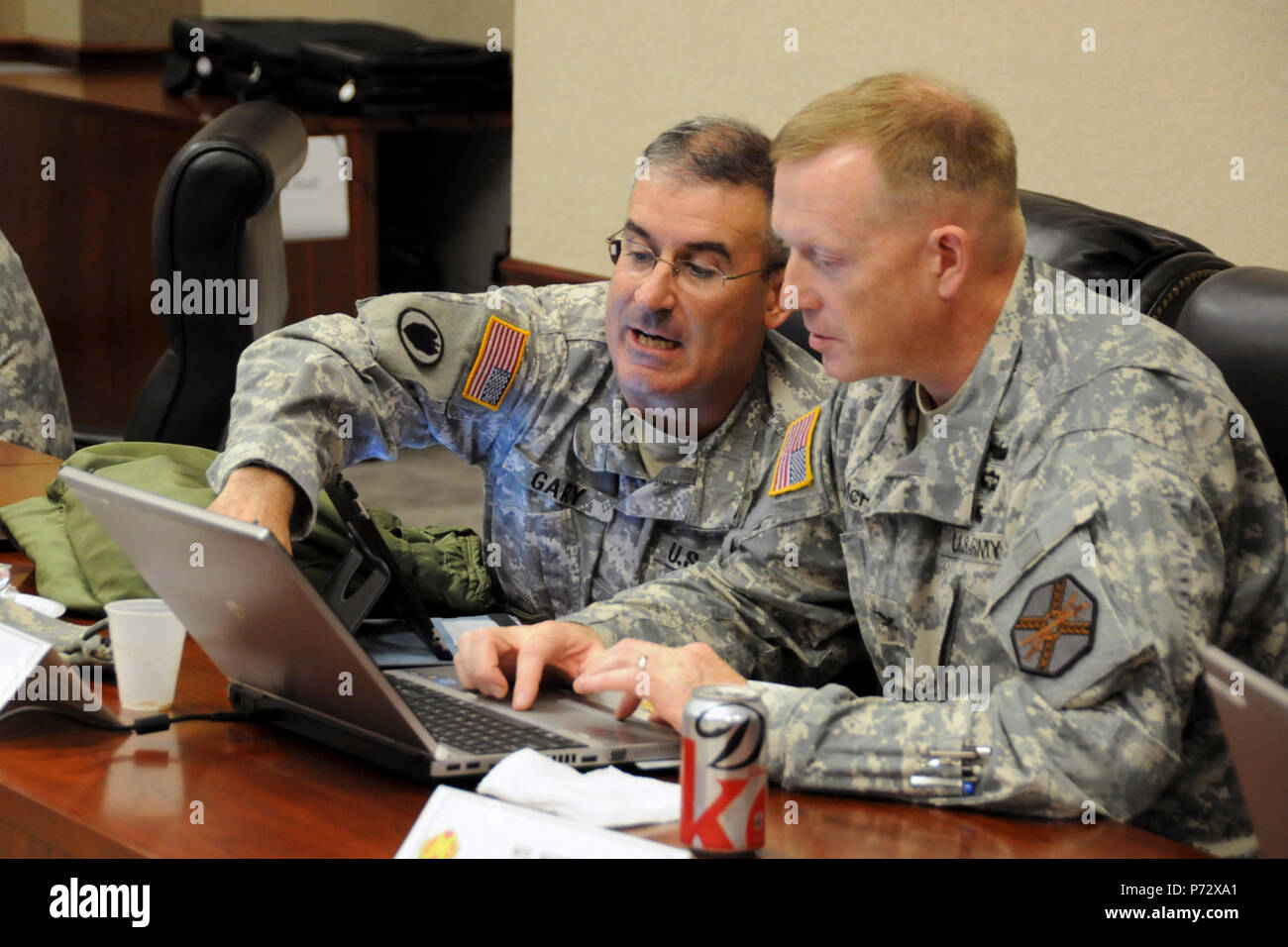 Lt. Col. Patrick Gary (left), staff judge advocate, consults Col ...
