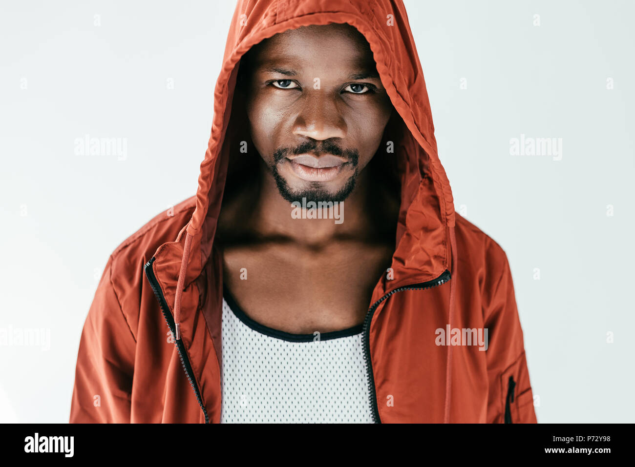 serious african american man in orange hood, isolated on white Stock ...