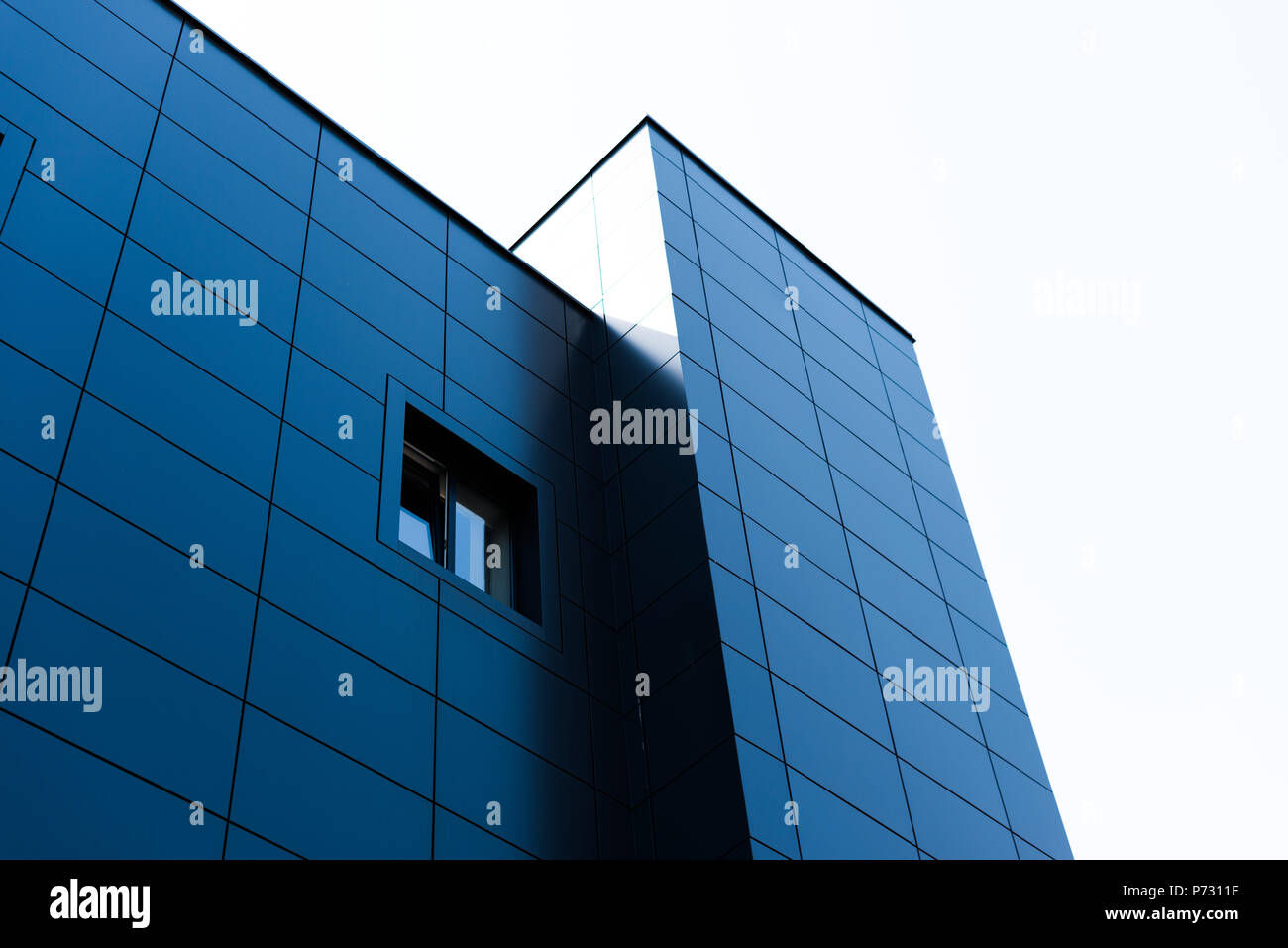 View of office building wall with single window Stock Photo - Alamy