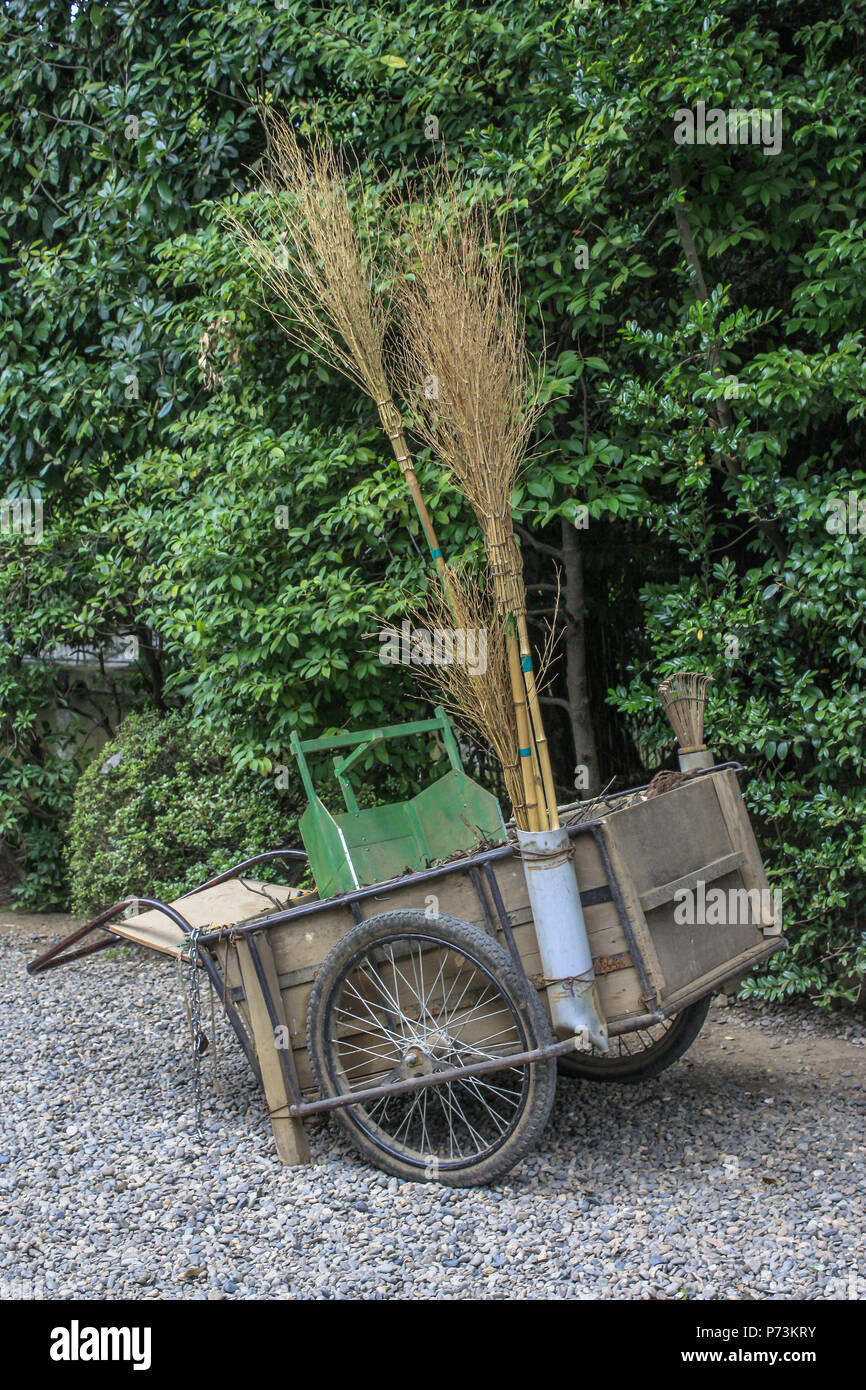A traditional Japanese gardener's cart and tools inside a historic ...