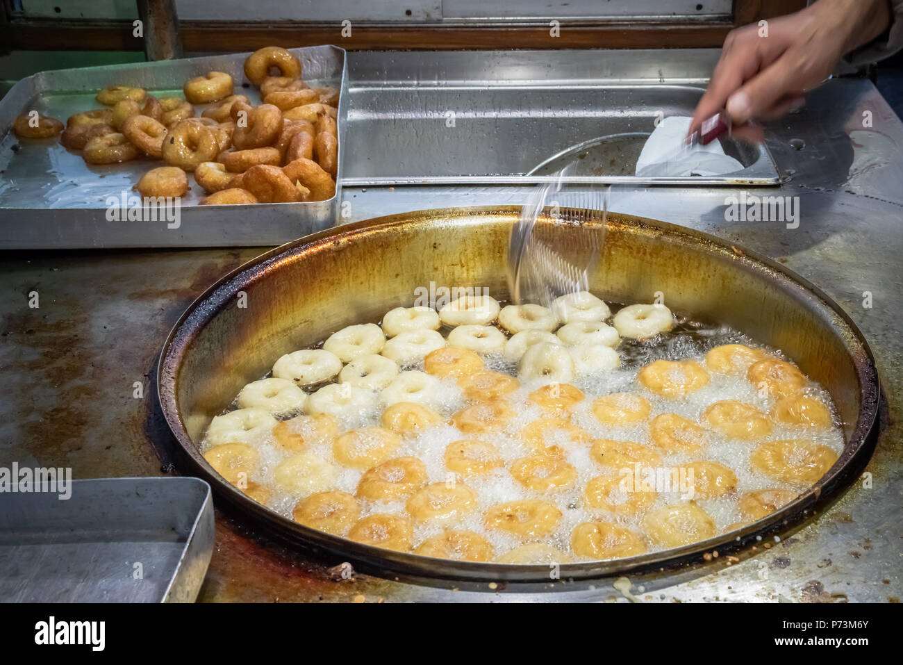 Lokma are pastries made of deep fried dough soaked in syrup, chocolate ...