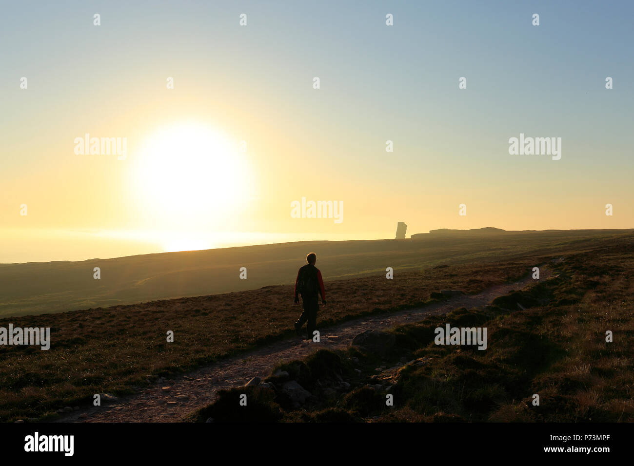 Old man walking alone sunset hi-res stock photography and images - Alamy