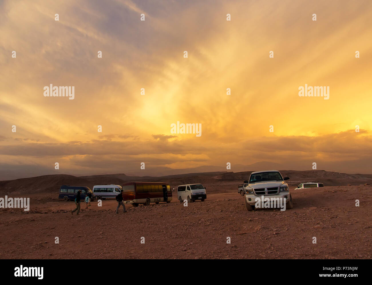 People watching a magnificent sunset in the Atacama desert Stock Photo ...