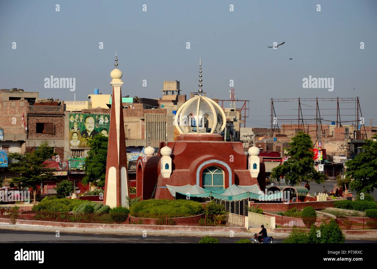 Modern mosque with transparent dome in city center traffic roundabout ...