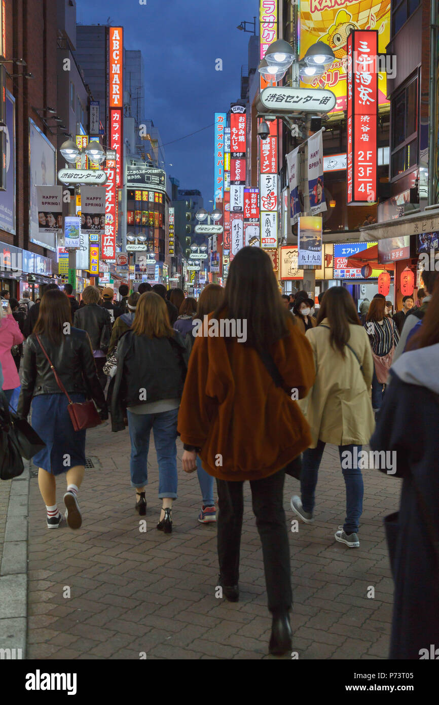 People walk to one derection in orderly manner on crowded street at ...