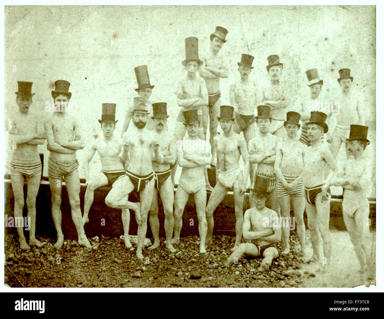 English: 19 members of the Brighton Swimming Club, in their top hats ...