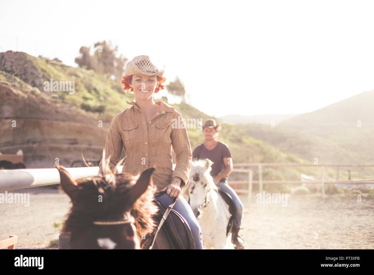 nice caucasian couple friends young people ride beautiful horses ...