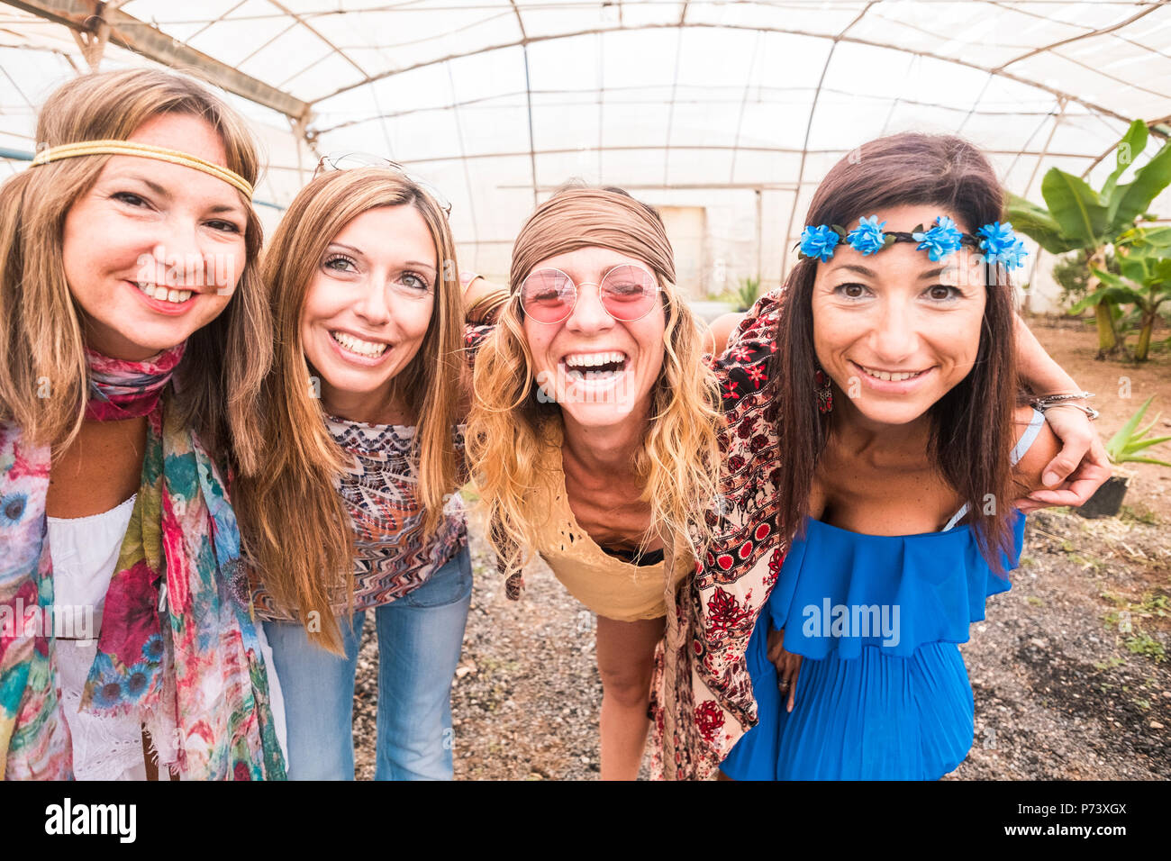 nice group of ladies women friends hugging and smiling togehter to the ...