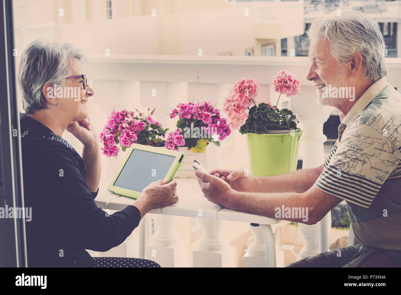 senior happy caucasian couple in outdoor leisure activity using ...