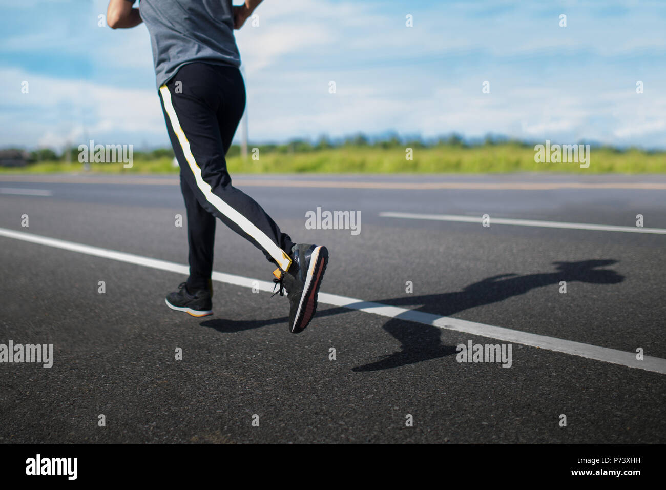 Athletic young man running in the nature. Healthy lifestyle Stock Photo ...