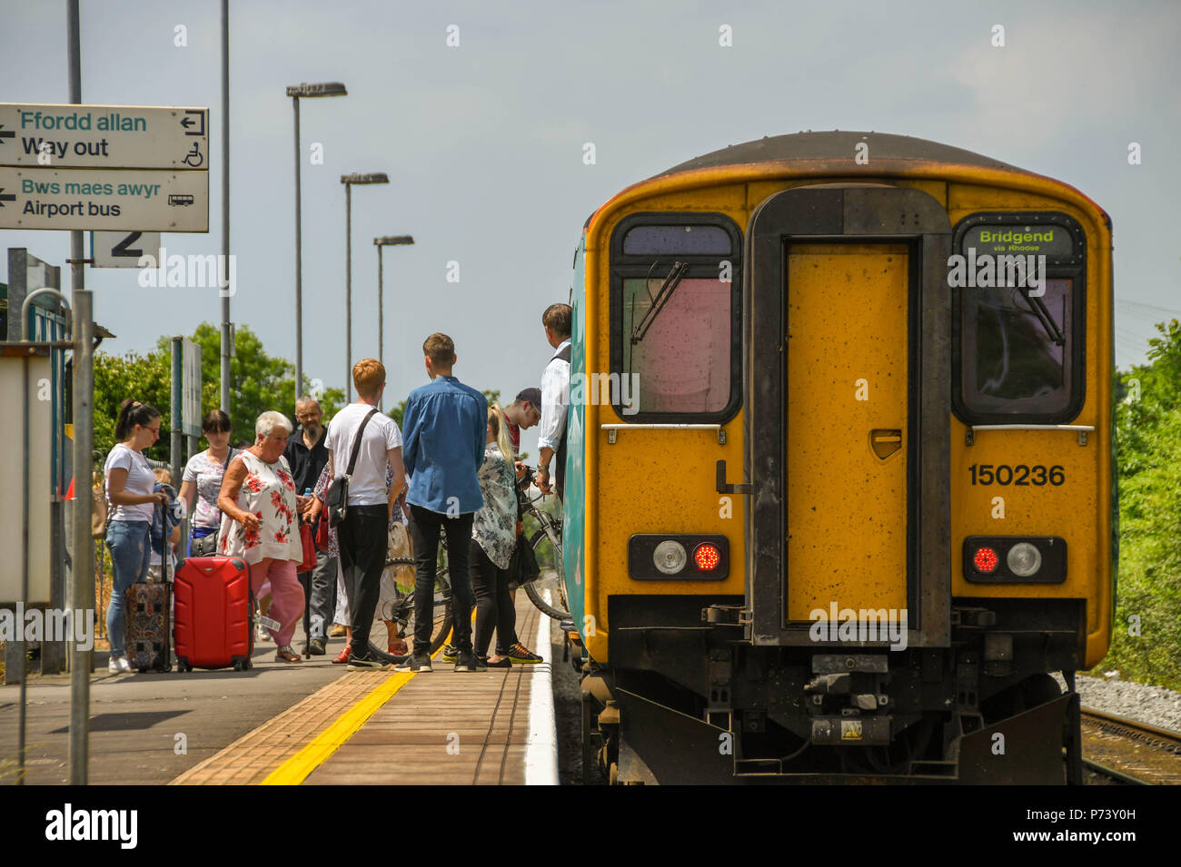 Passengers getting on a diesel commuter train on Platform 2 at Rhoose ...