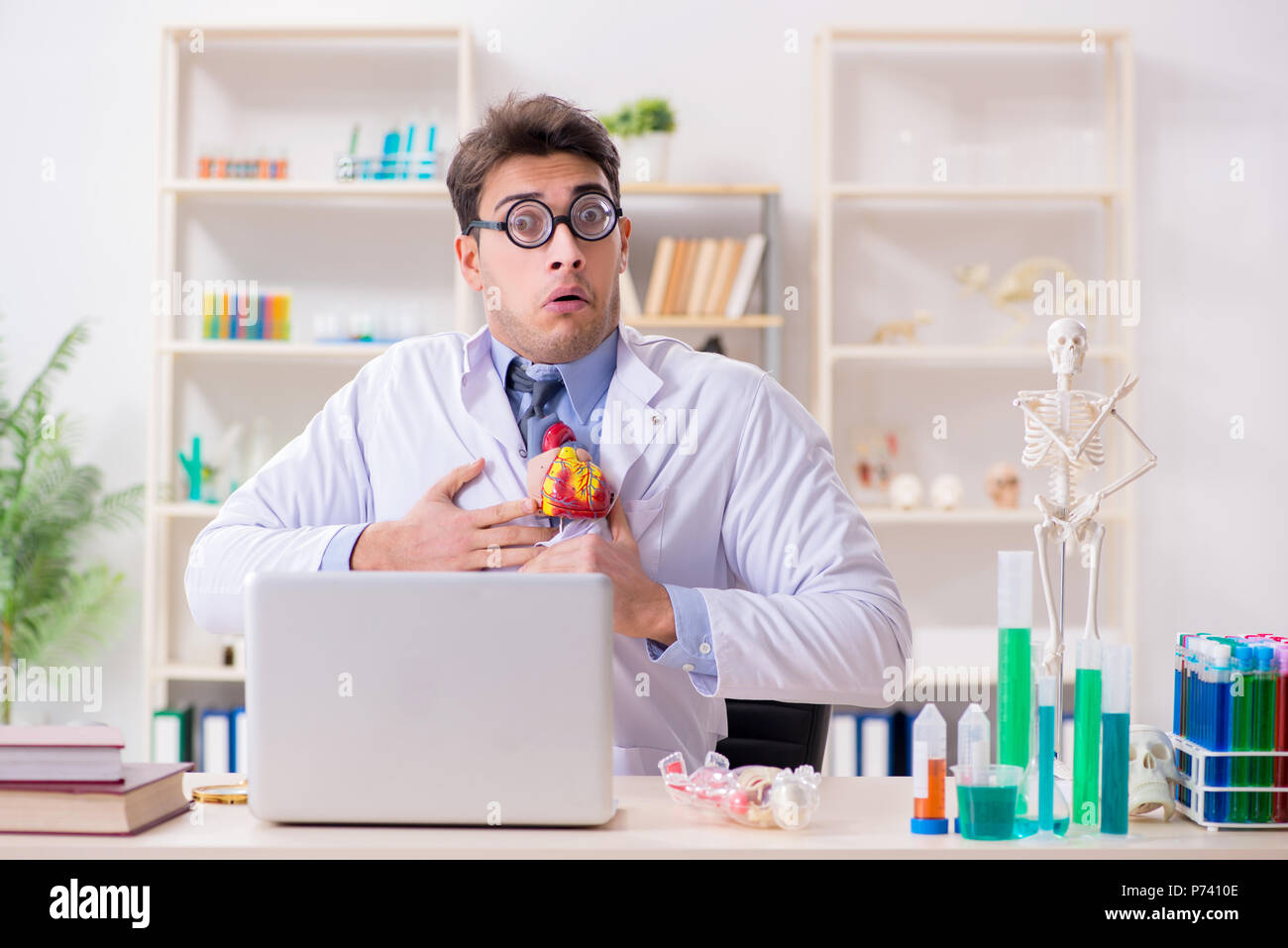 Funny doctor having fun in hospital lab Stock Photo - Alamy