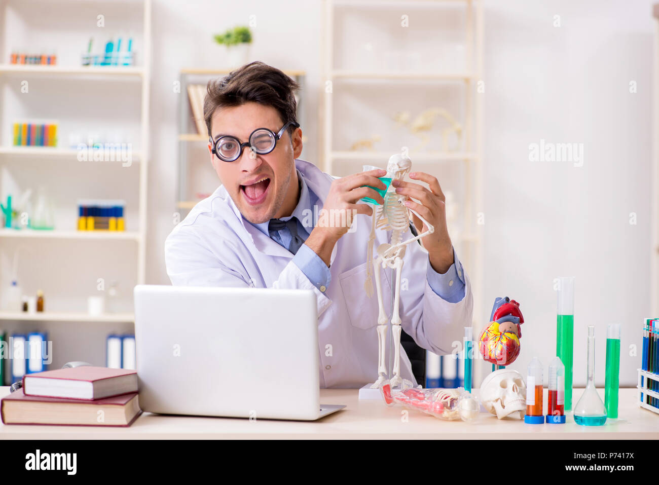 Funny doctor having fun in hospital lab Stock Photo - Alamy