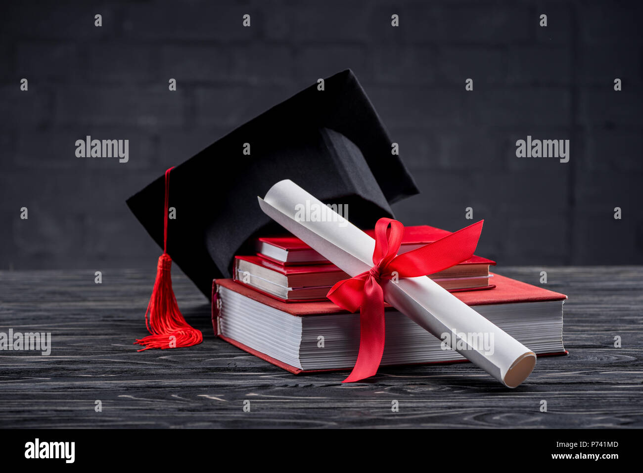 Books and diploma on table hi-res stock photography and images - Alamy