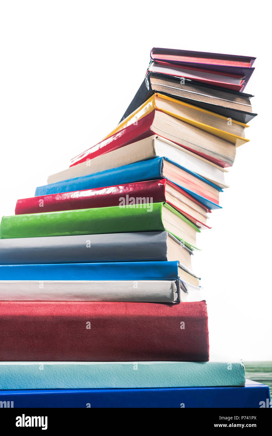 Spiral tower of colorful stacked books Stock Photo - Alamy