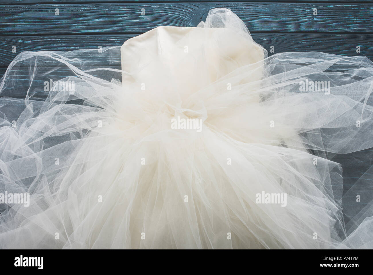 top view of wedding dress on wooden dark blue tabletop Stock Photo - Alamy