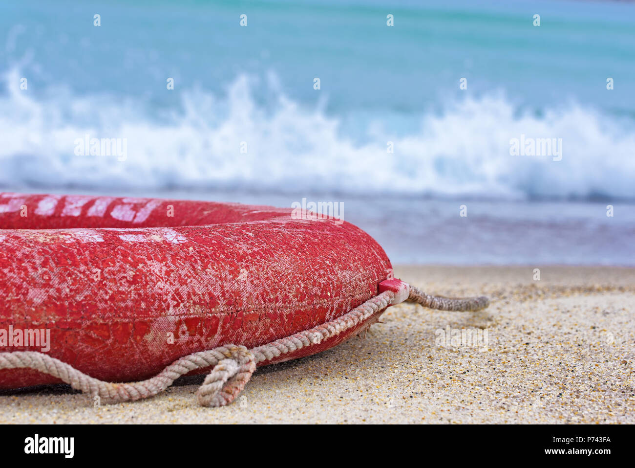 Lifebuoy on the beach. Concept of saving lives Stock Photo - Alamy