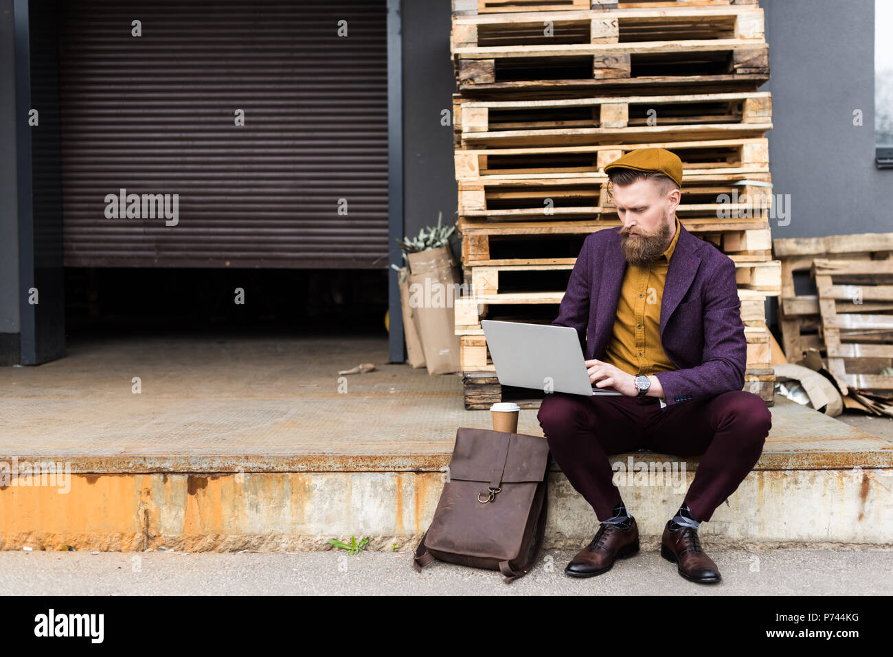 Businessman working on laptop in street hi-res stock photography and ...
