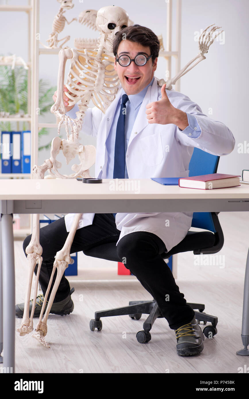 Crazy professor studying human skeleton Stock Photo - Alamy