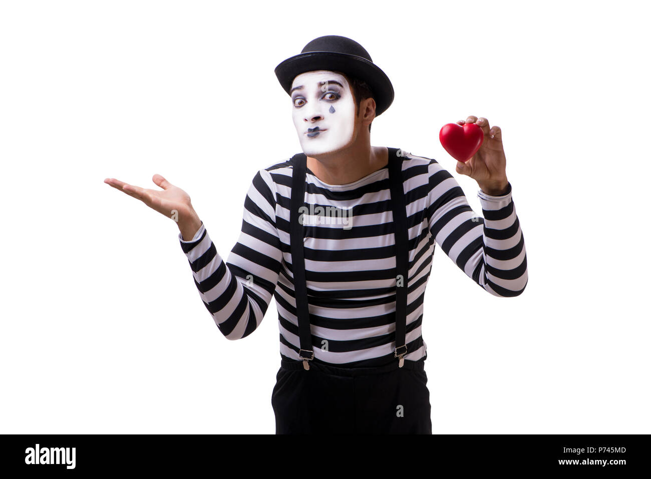 Mime holding red heart isolated on white background Stock Photo - Alamy