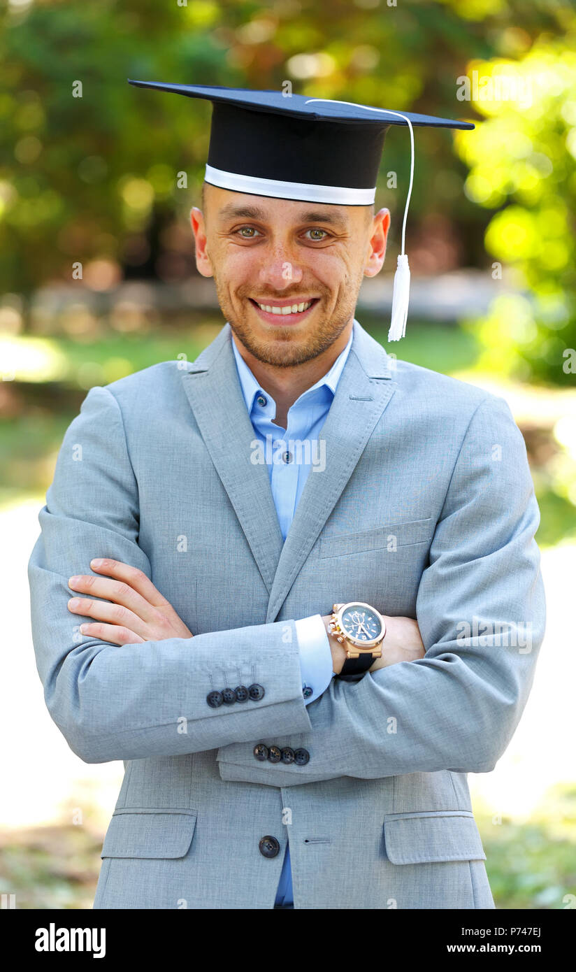 Happy graduateing student wearing graduation hat Stock Photo - Alamy