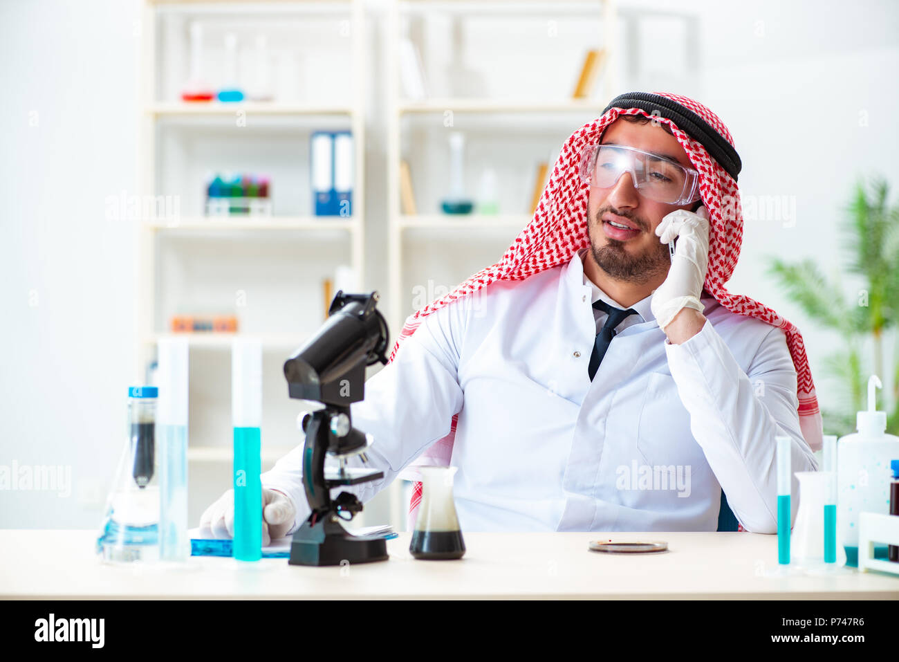 Arab chemist scientist testing quality of oil petrol Stock Photo - Alamy