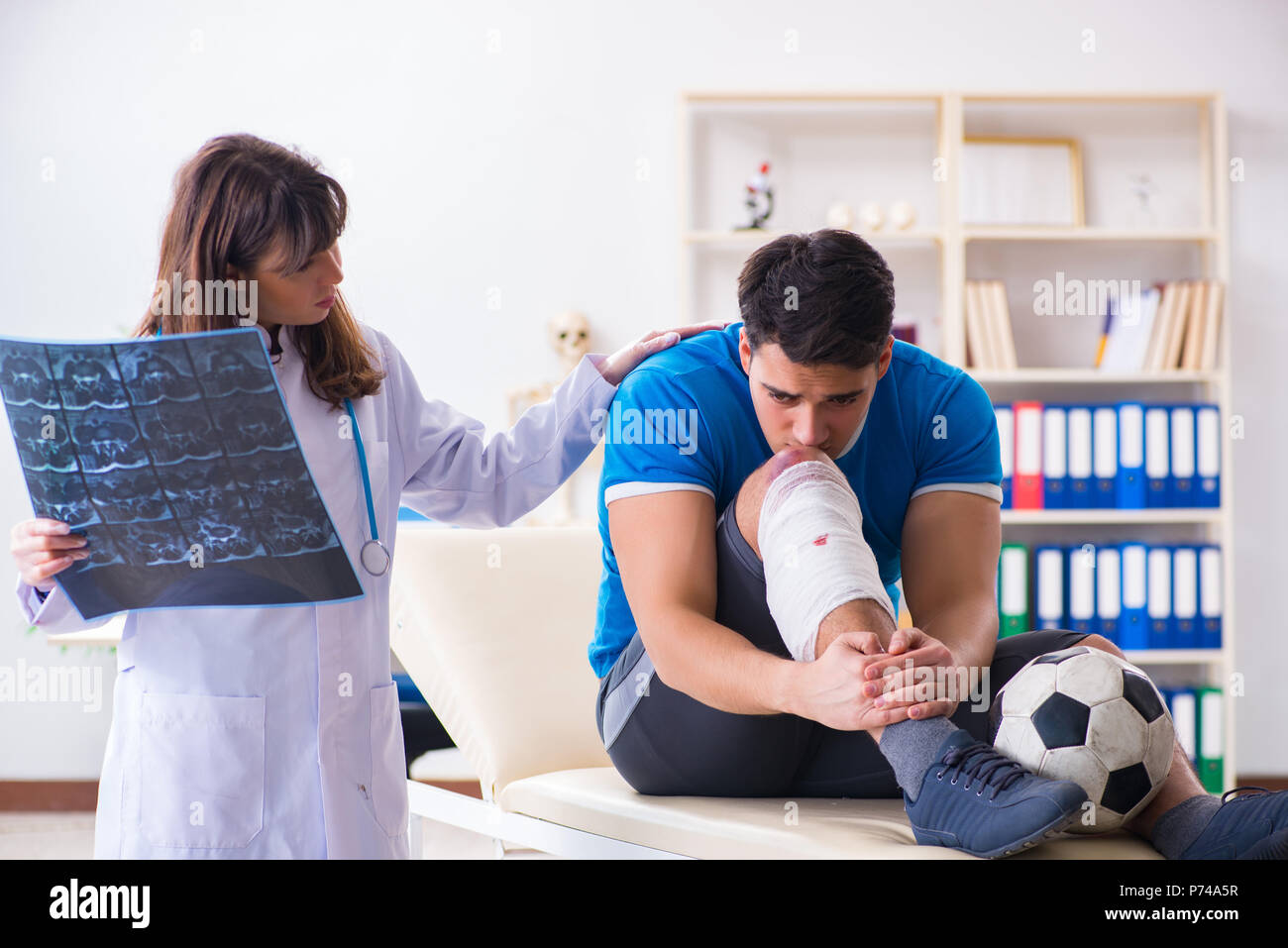 Football soccer player visiting doctor after injury Stock Photo - Alamy