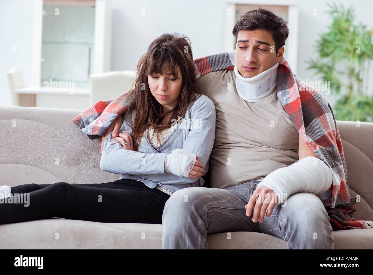 Injured family of wife and husband recovering at home Stock Photo - Alamy