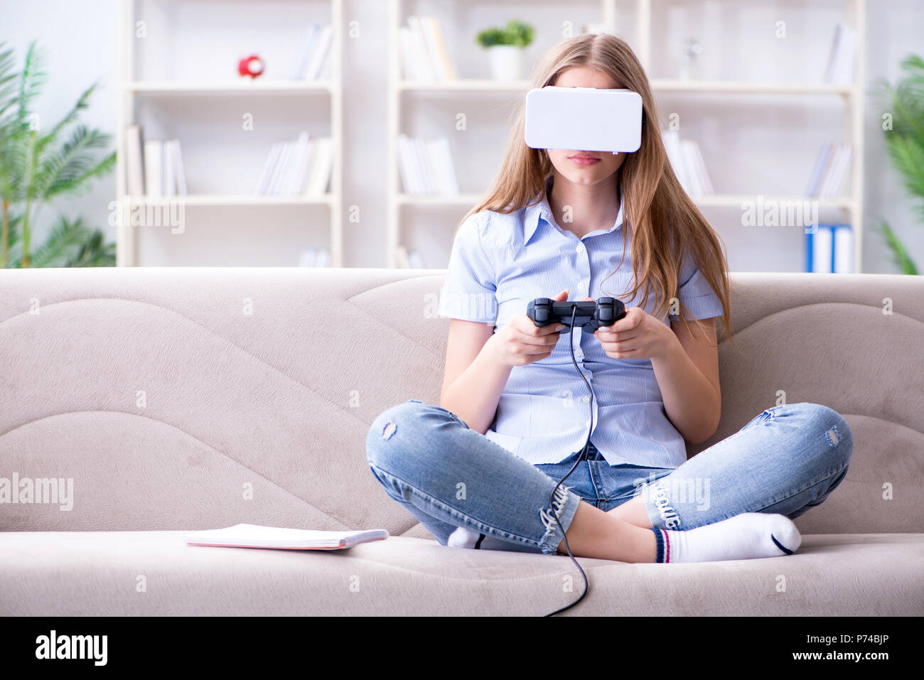 Young girl playing virtual reality games Stock Photo - Alamy