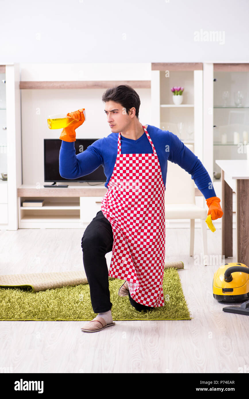 Contractor man cleaning house doing chores Stock Photo - Alamy
