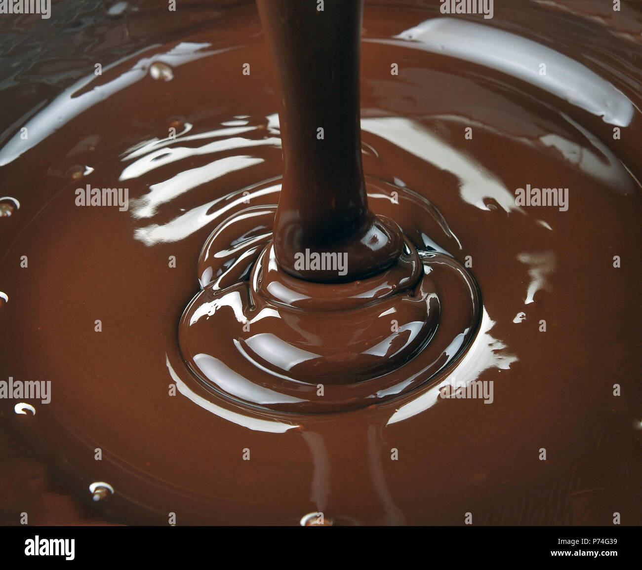 lots of chocolate falling from above Stock Photo - Alamy