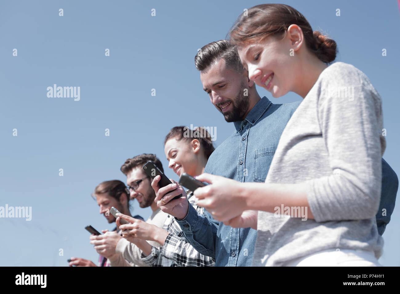 young people using smartphones to search network Stock Photo - Alamy