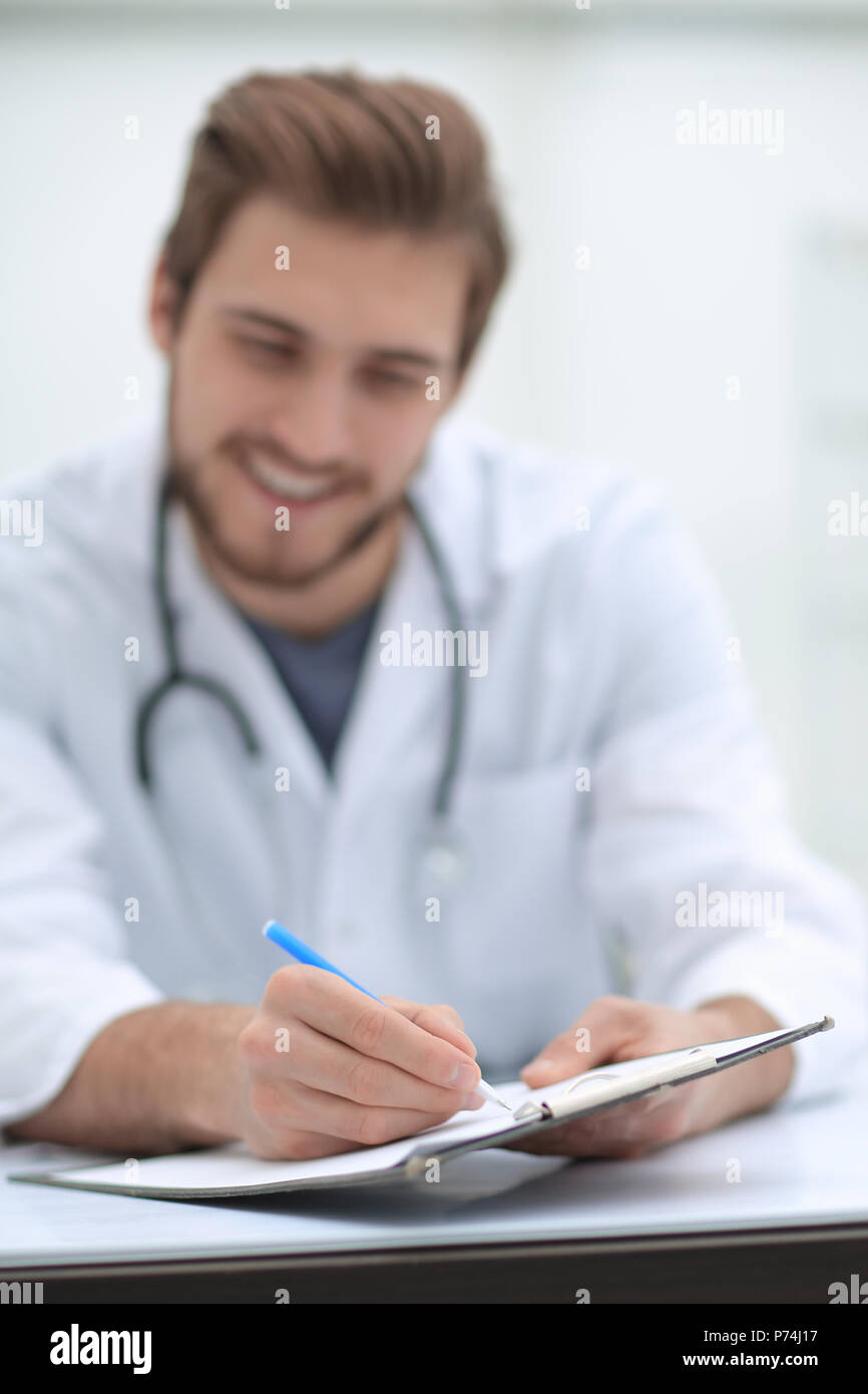 background image of a doctor writing out a prescription Stock Photo - Alamy