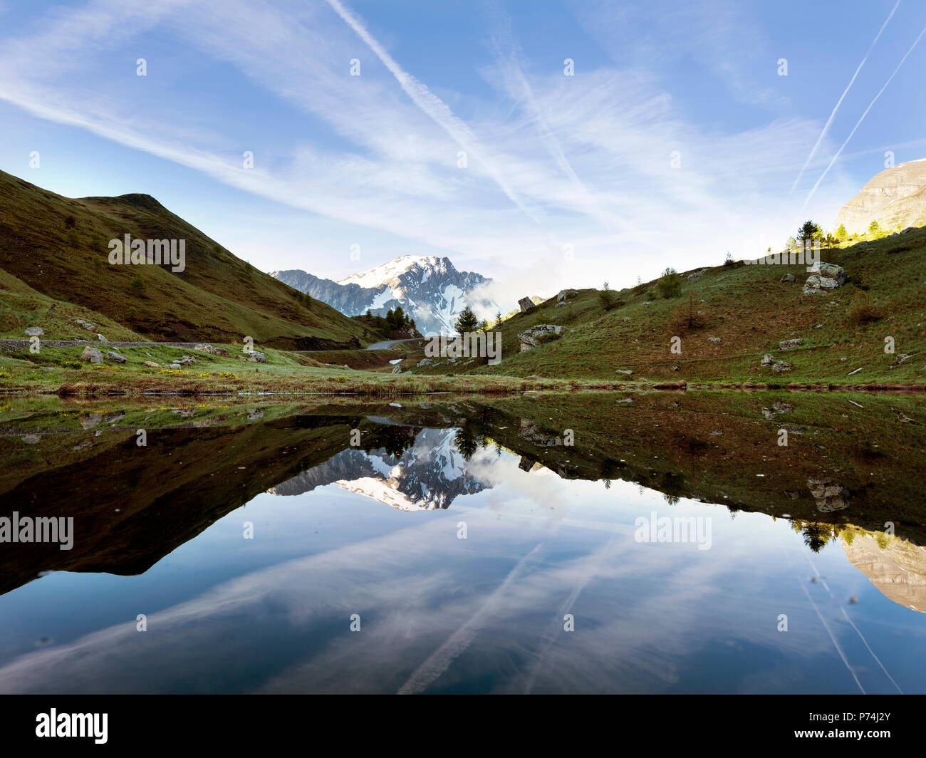 snow capped mountain near col de vars in the french provence reflected ...