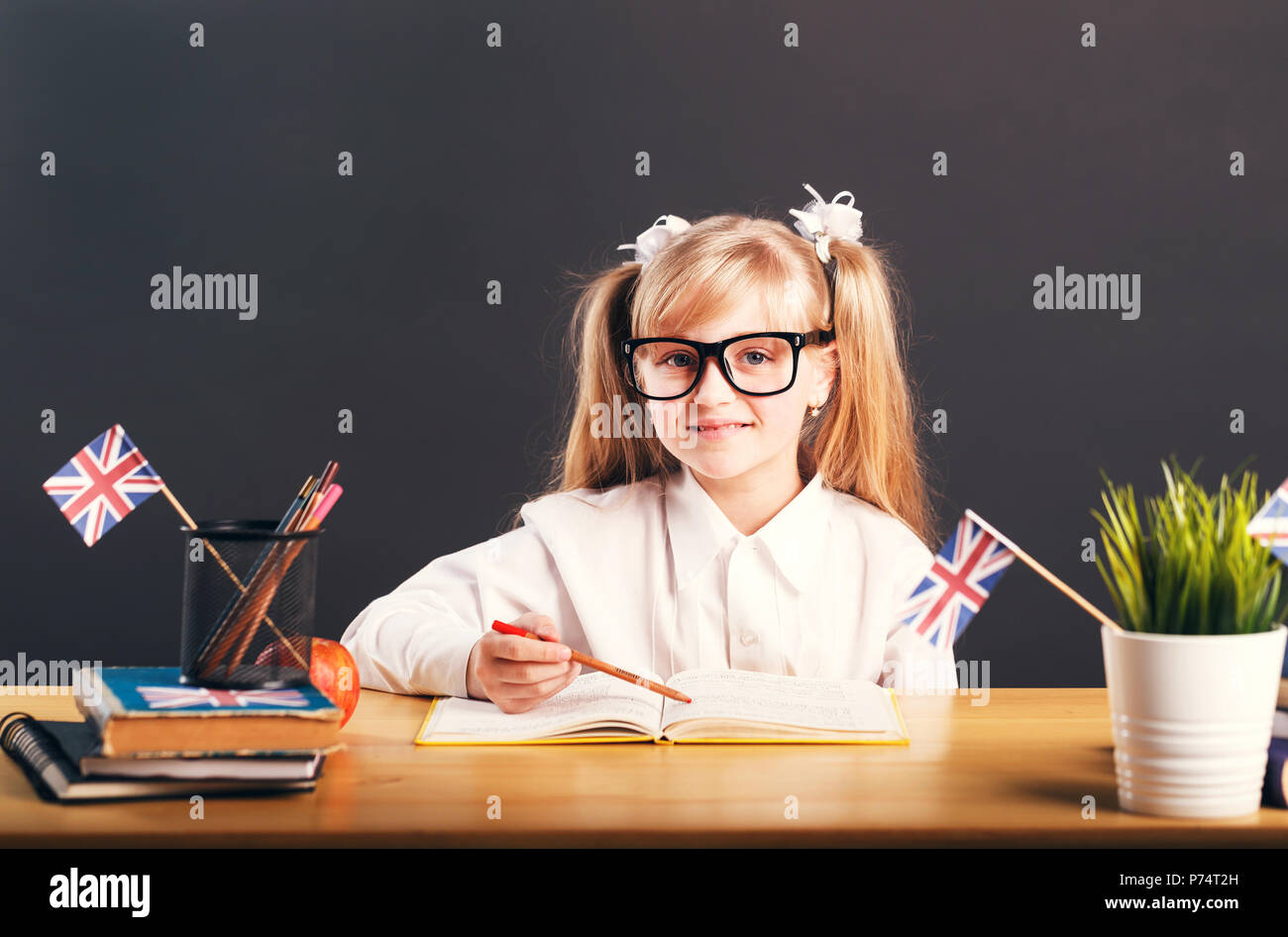 Happy smiling girl wears in smart eyeglasses learning English language ...