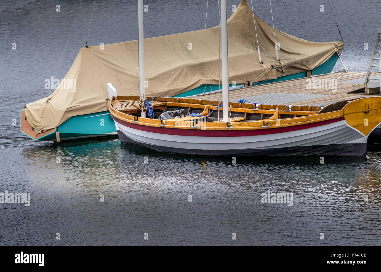 Covered boats moored sea sky boat hi-res stock photography and images ...