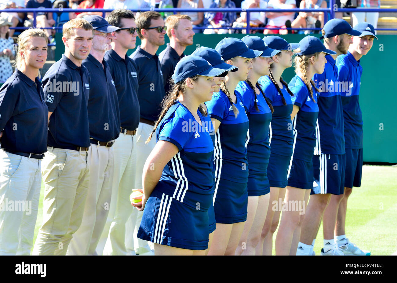 Ball boys and girls lining up with line judges on centre court after ...